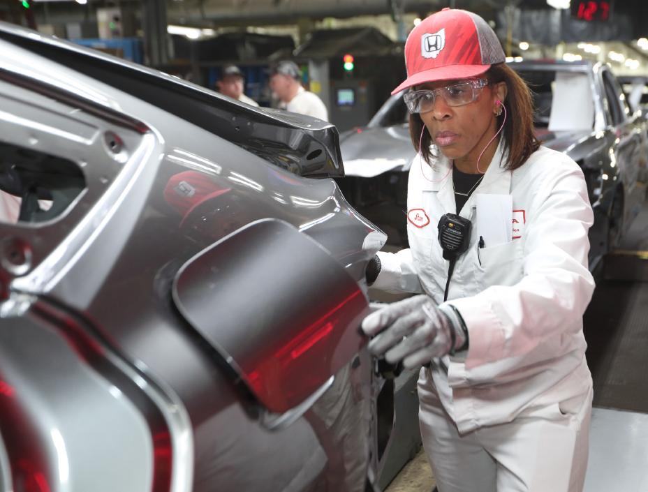 An associate works on an Acura vehicle in Ohio, where two of the top 10 ...