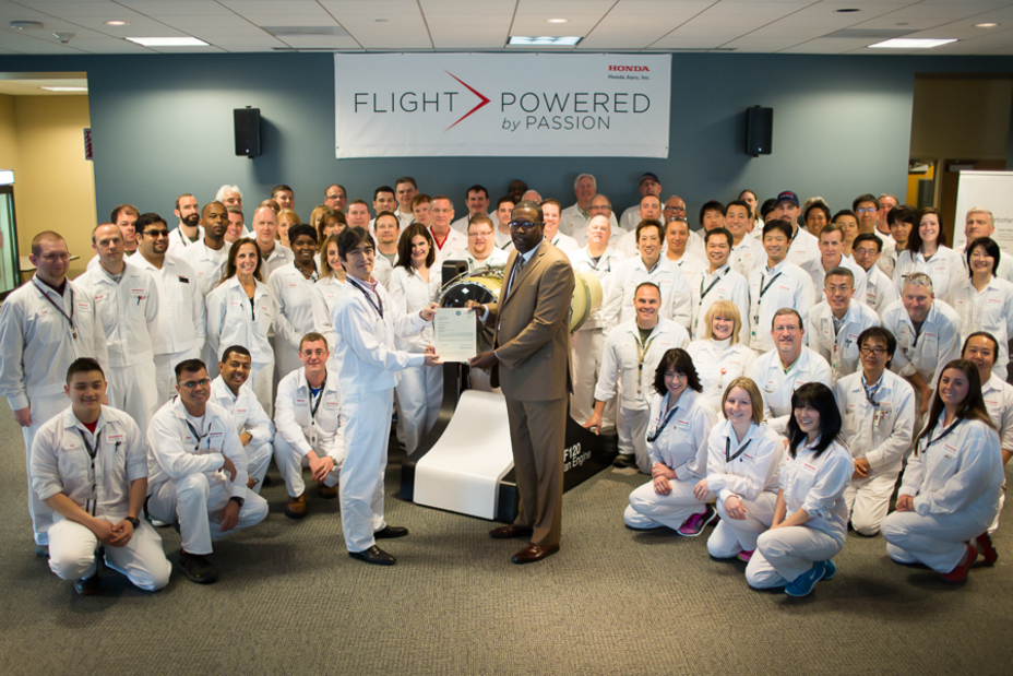 FAA Manager Greg Benson (right) awards HAI President Masahiko Izumi ...